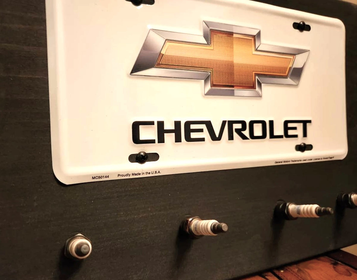 Chevy - White License Plate Spark Plug Rack